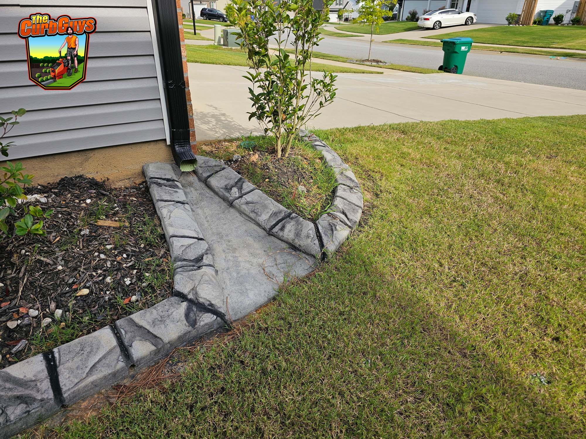 Custom Concrete Gutter Downspout Extension Splash Pads | The Curb Guys